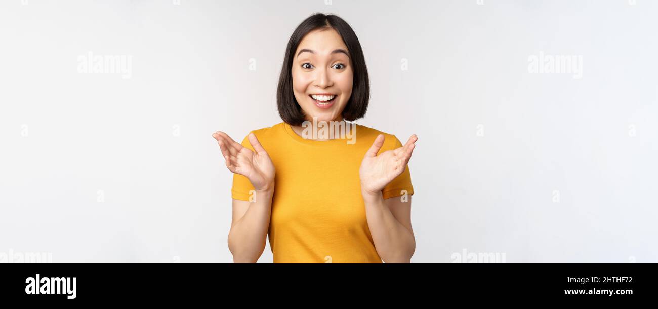 Close up portrait of asian woman looking surprised, wow face, staring ...