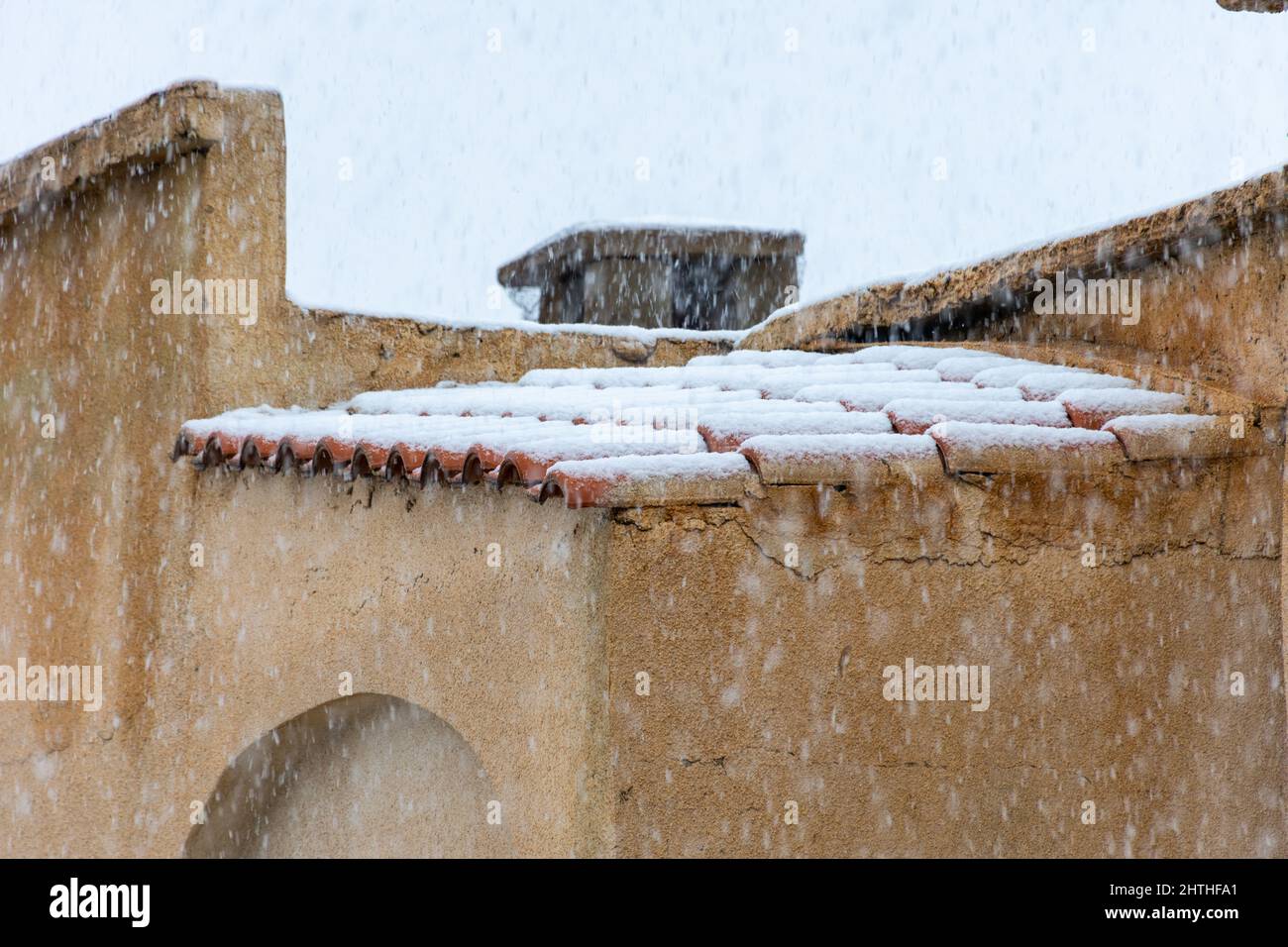 Snow-covered building rooftop brick. Winter concept Stock Photo - Alamy
