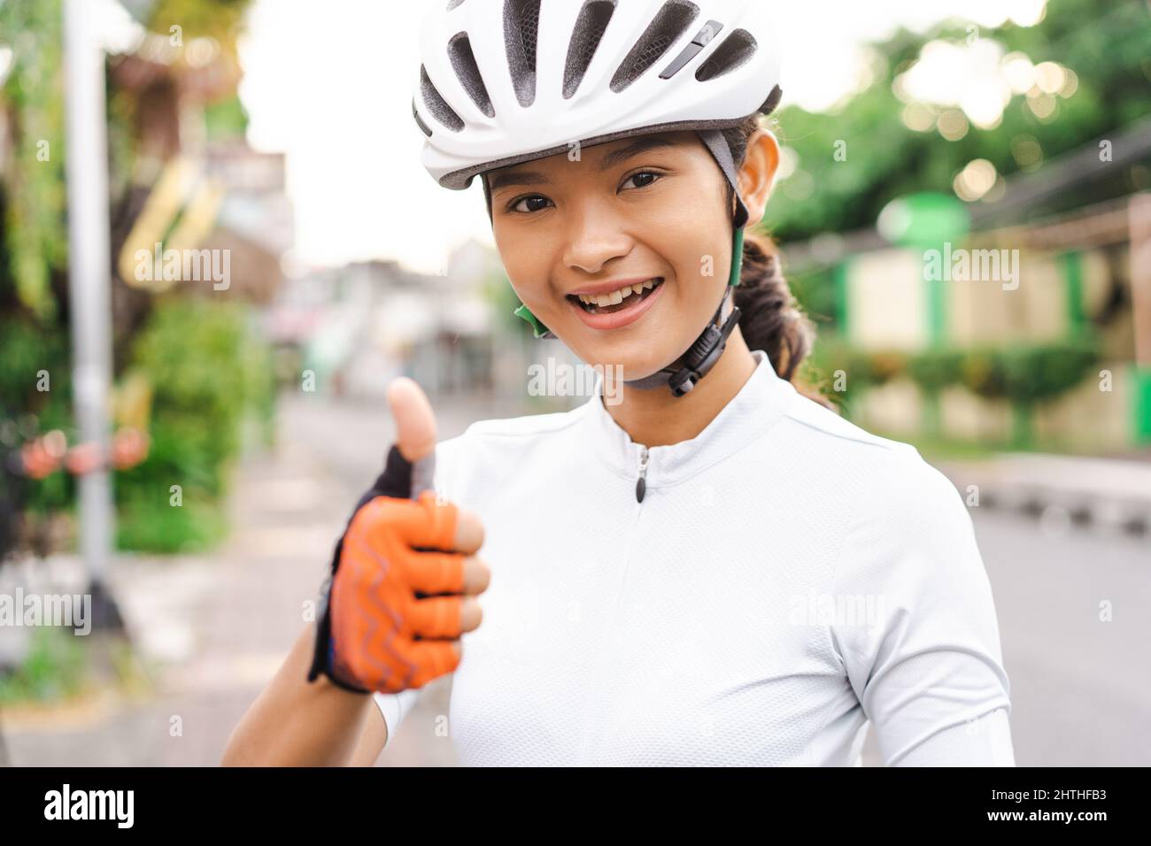 Woman thumbs up bike hi-res stock photography and images - Alamy