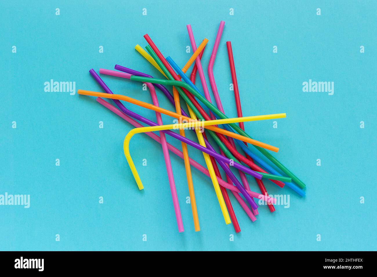 Pile of plastic disposable multi colored drinking straws for cocktails ...