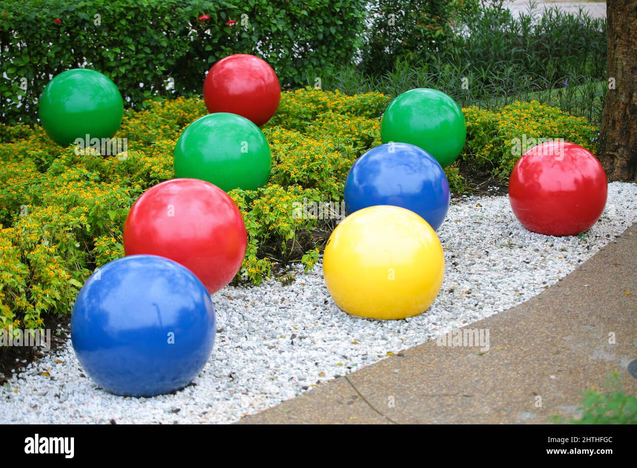 Big round ball replicas decorated a garden Stock Photo - Alamy