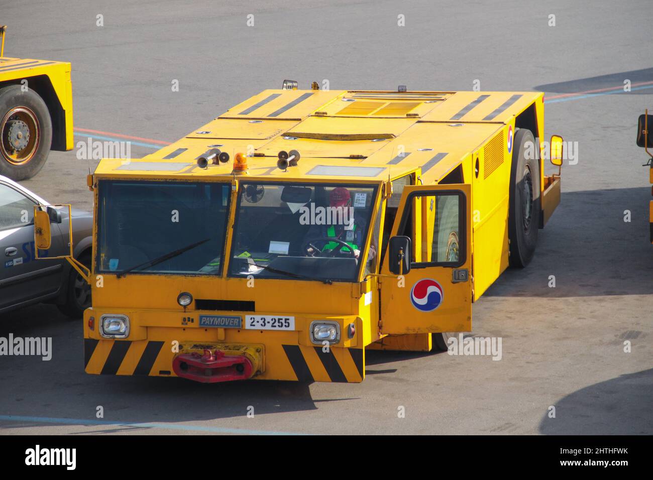 Technician getting ready the yellow colour pushback tug or tractor for ...