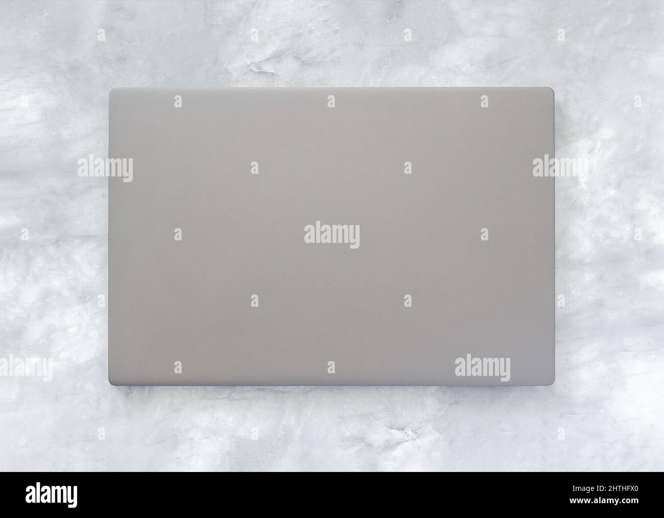 Closed gray laptop on marble background. Top view Template Stock Photo ...