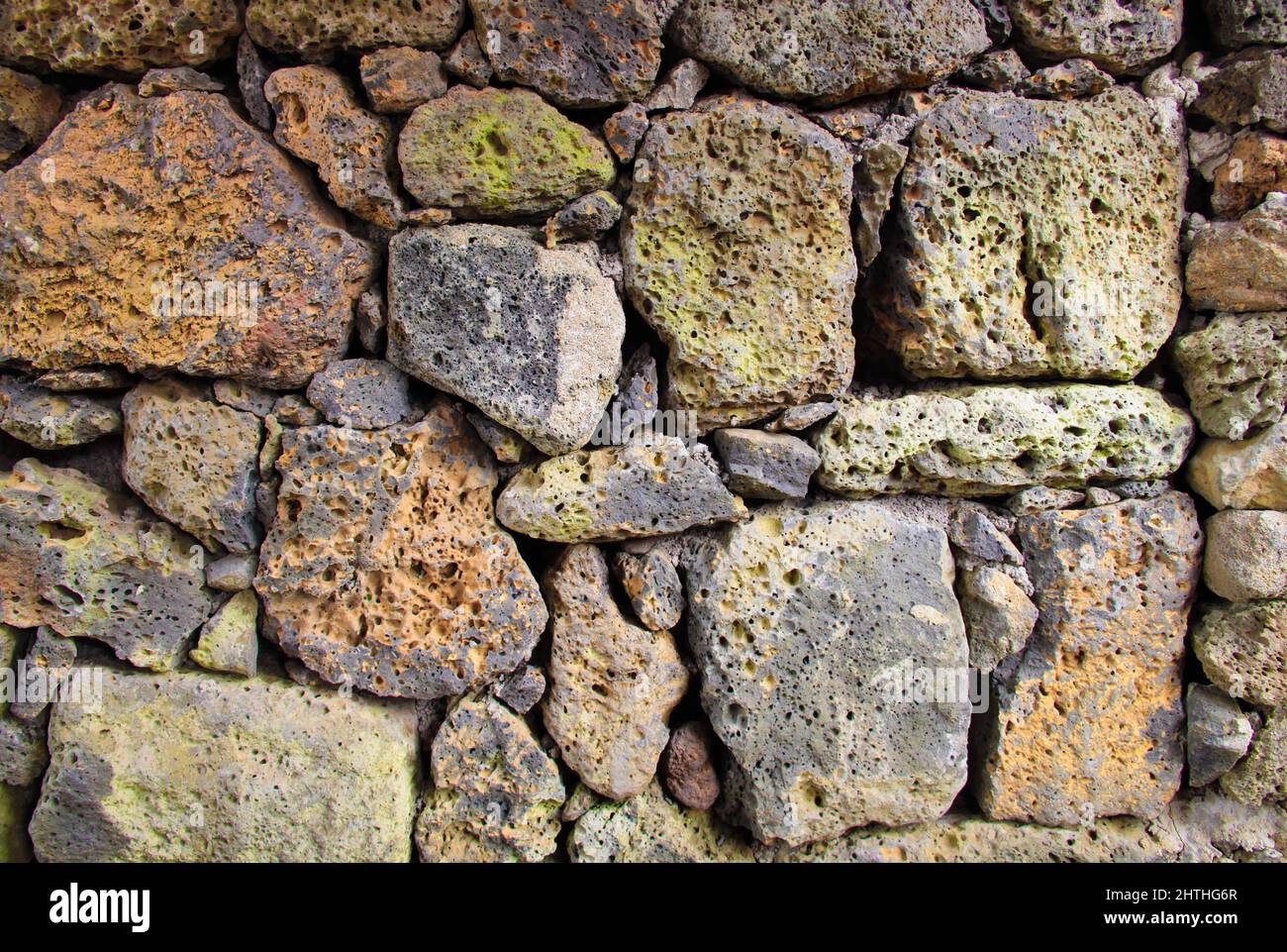 Wall of volcano rocks Stock Photo - Alamy