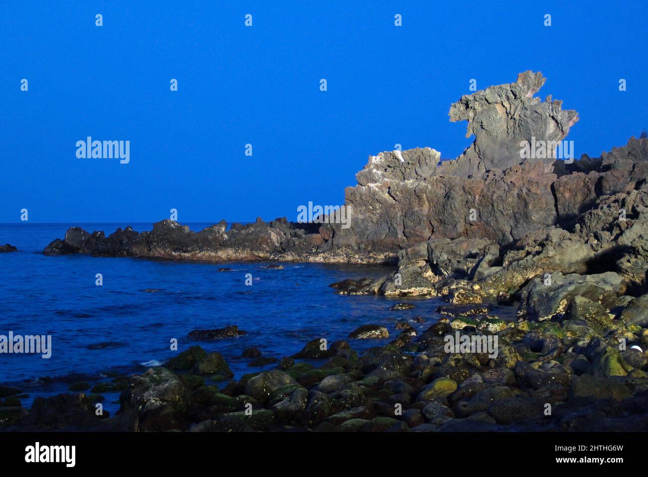 Dragon Head Rock of Jeju Island, South Korea. Known as Yongduam rock in ...