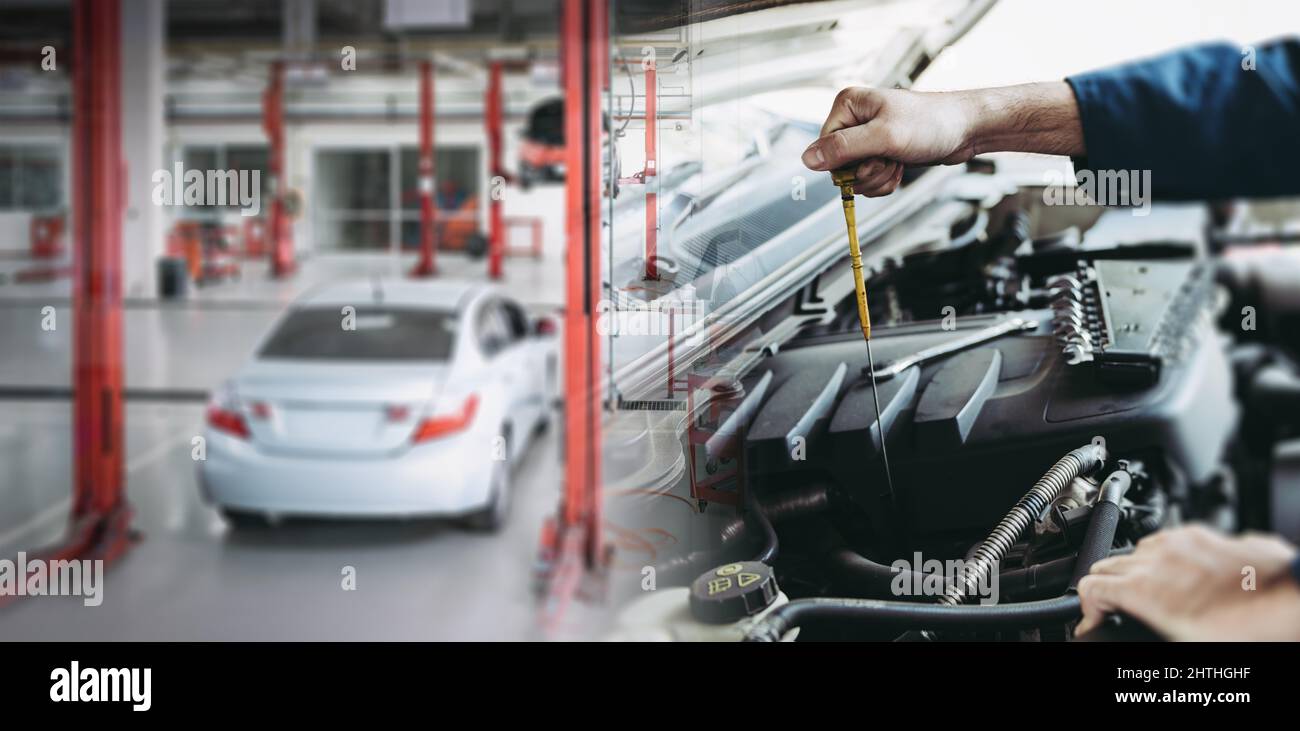 Car Repairman is Checking Engine Oil Level in Automotive Workshop ...