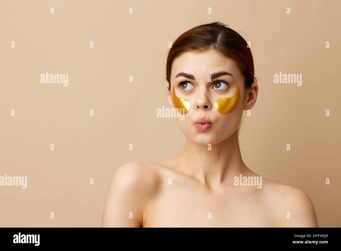 woman golden patches on the face isolated background Stock Photo - Alamy