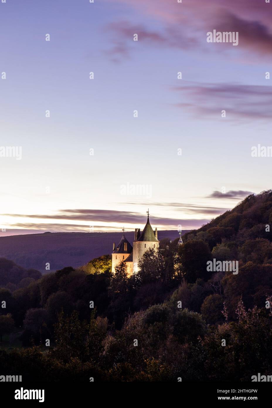 Aerial view of the Castell Coch in Cardiff, Wales under green mountains ...
