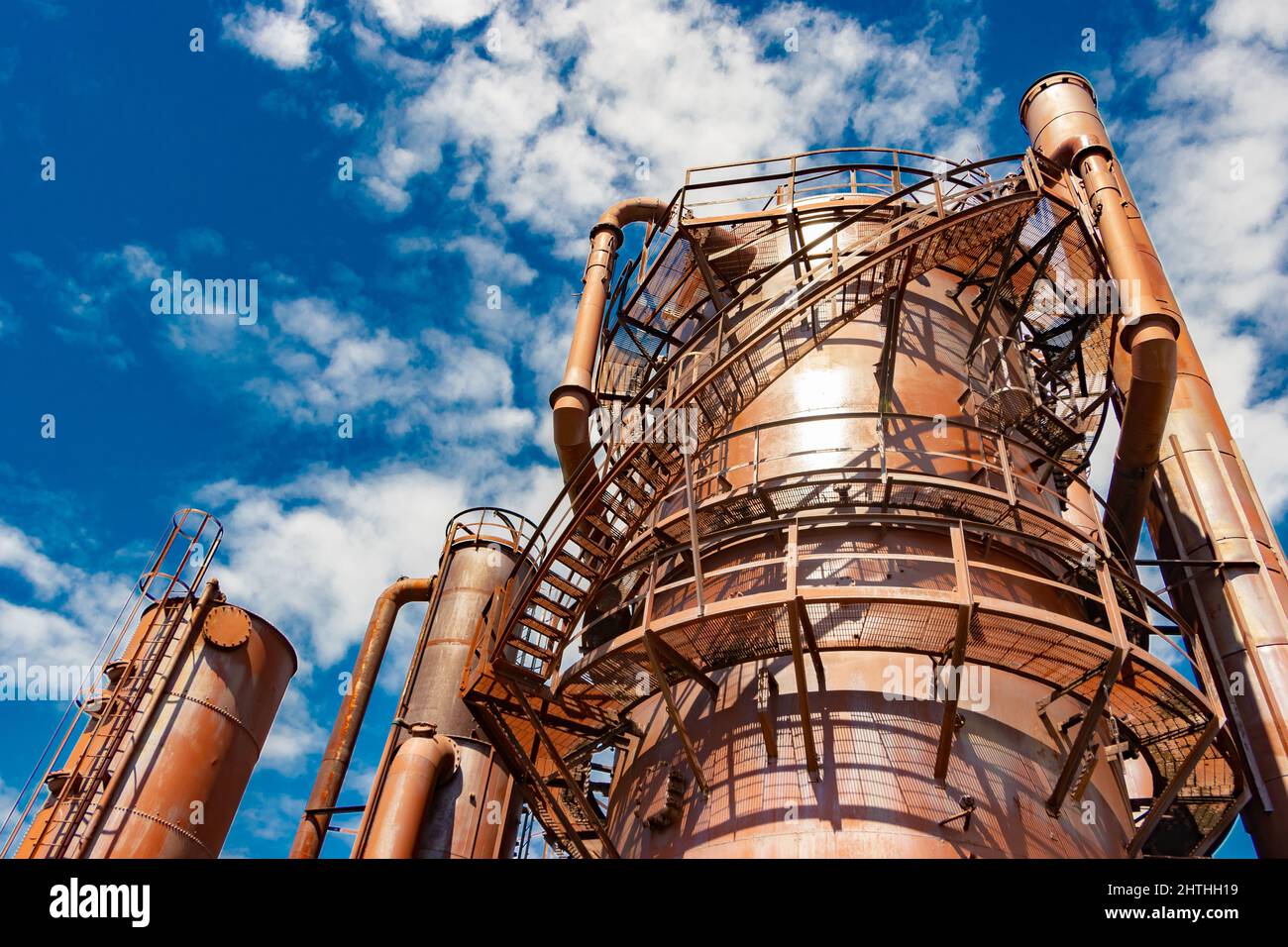rusty gasification plant against blue sky at gas works park in Seattle ...
