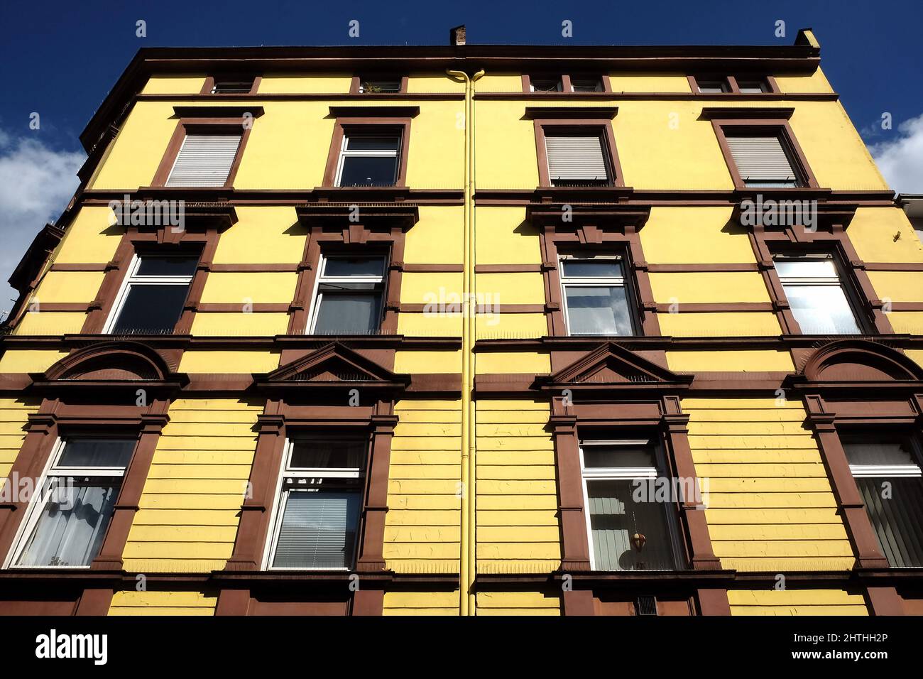 Low angle of an old yellow building Stock Photo - Alamy