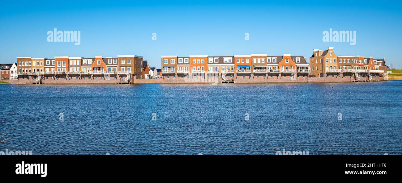 Panoramic view of modern houses in old Dutch style in new housing ...
