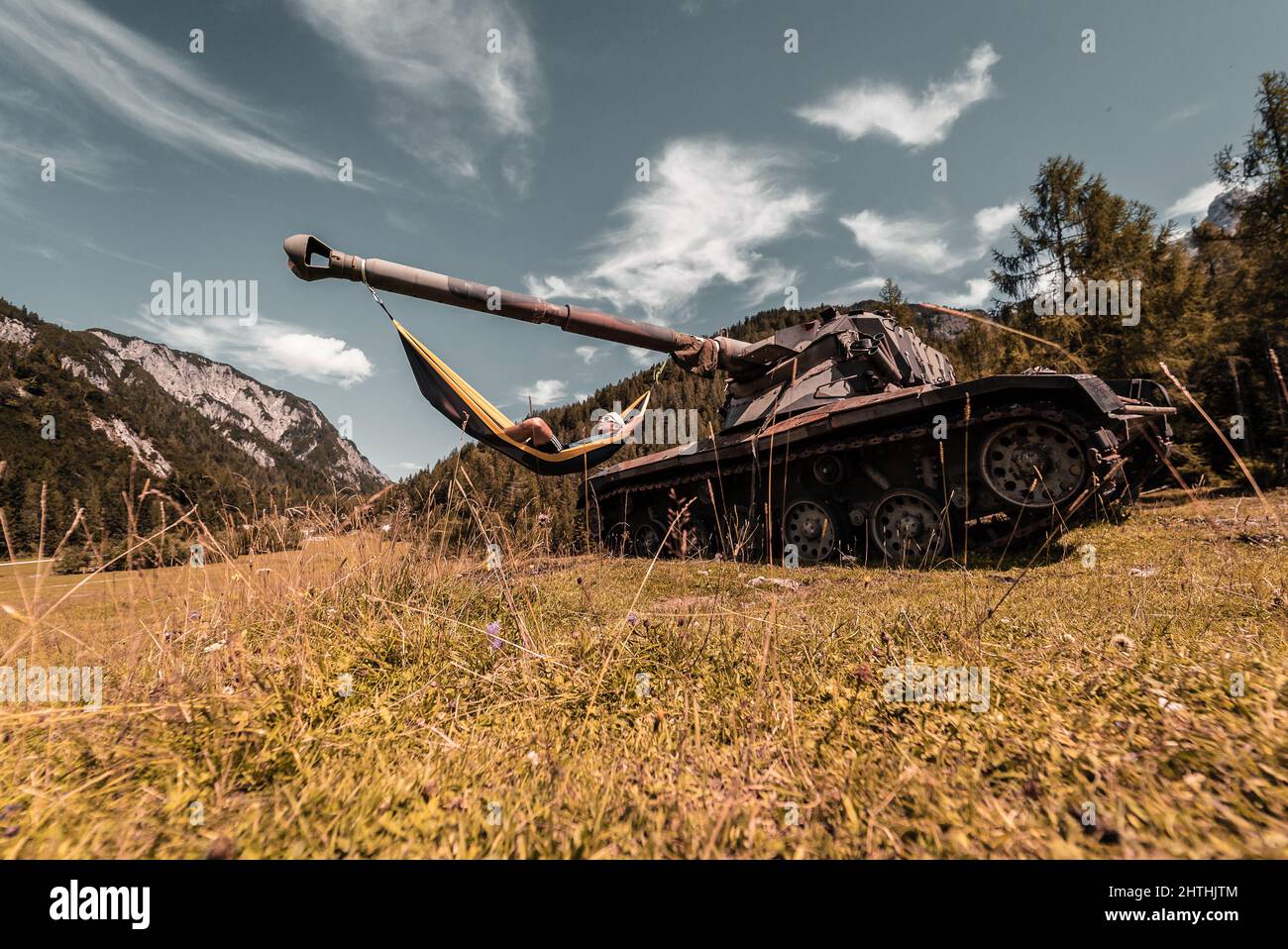 Old abandoned rusty damaged tank under a blue cloudy sky Stock Photo ...