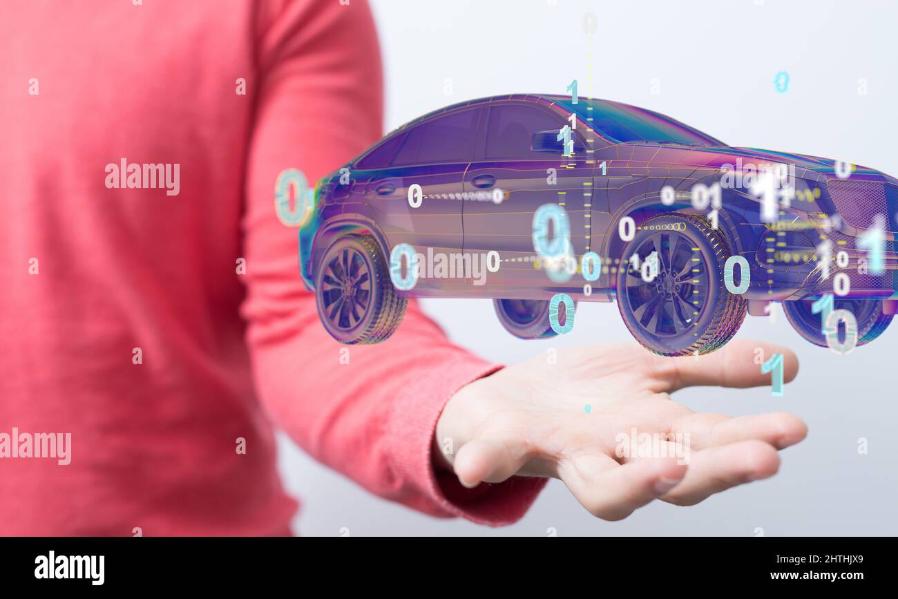 Close-up of an autopilot car hovering over a hand -self-driving and ...