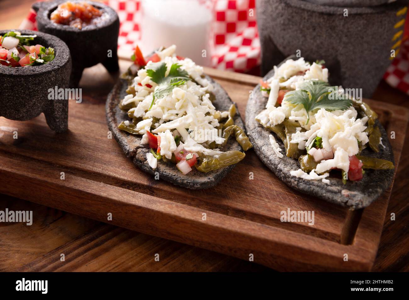 Tlacoyos and Nopales. Mexican pre hispanic dish made of blue corn flour ...