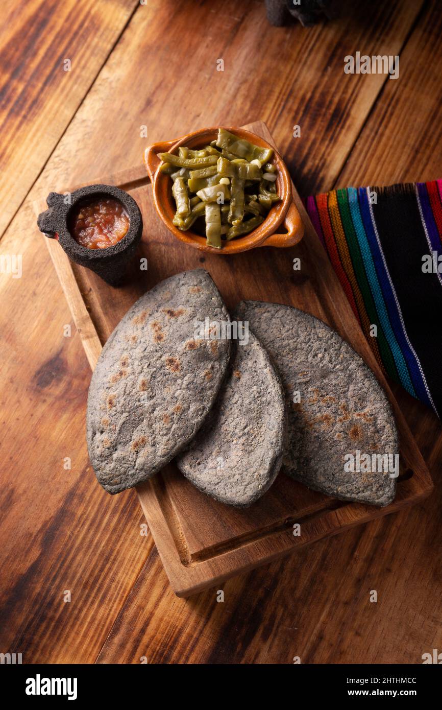 Tlacoyos. Mexican pre hispanic dish made of blue corn flour patty ...