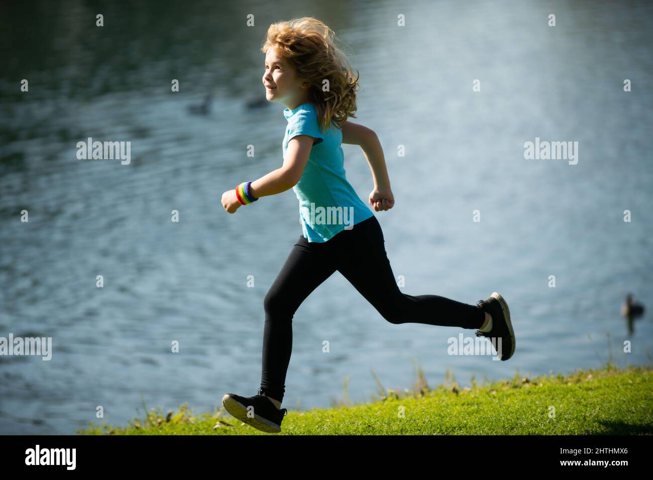 Kids running outdoors. Child runner jogger running in the nature ...