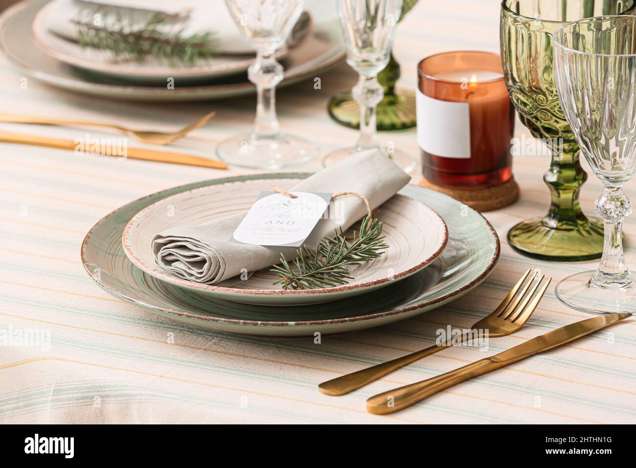 Stylish table setting with wedding invitation Stock Photo - Alamy