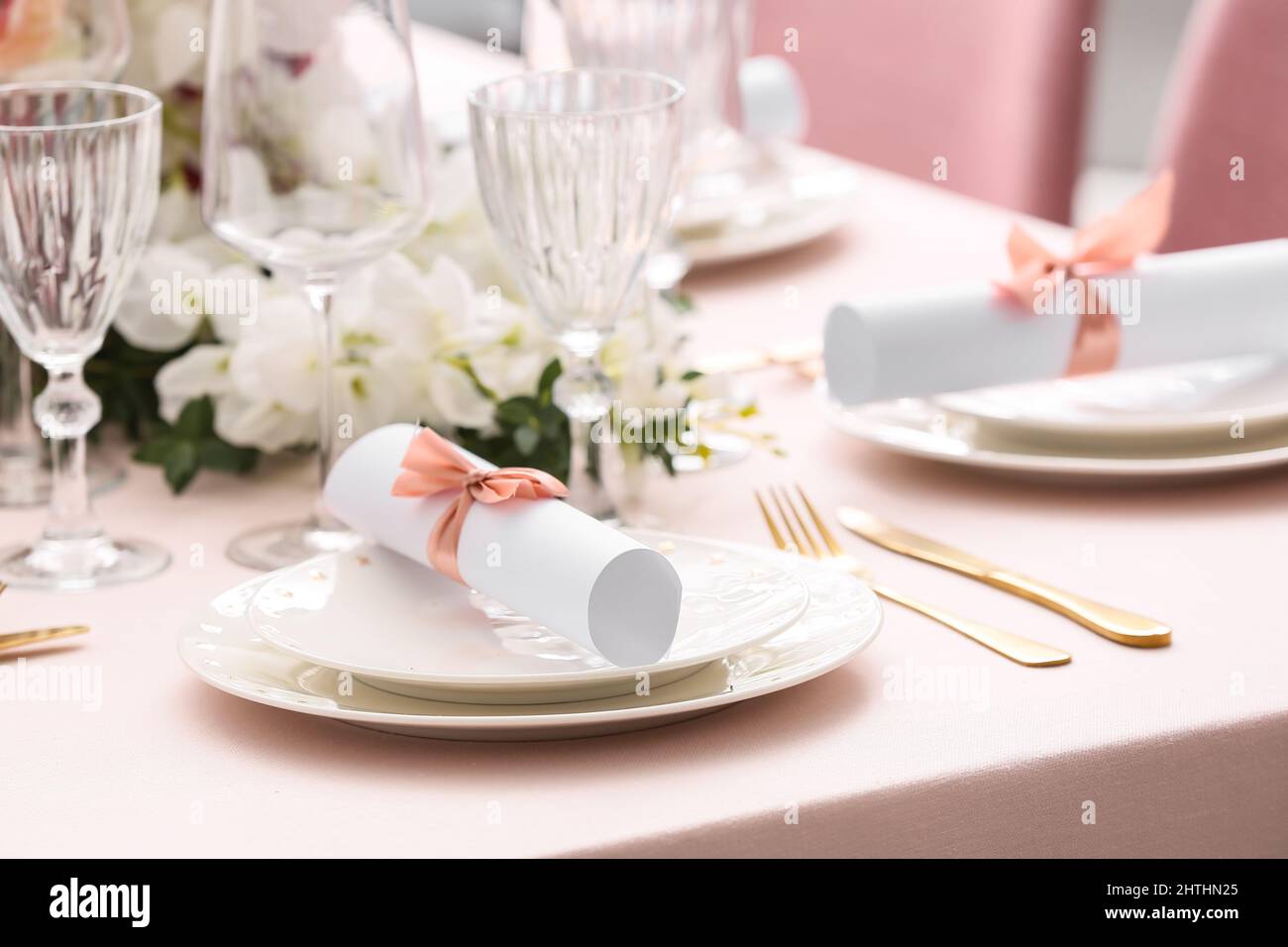 Stylish table setting with wedding invitations Stock Photo - Alamy