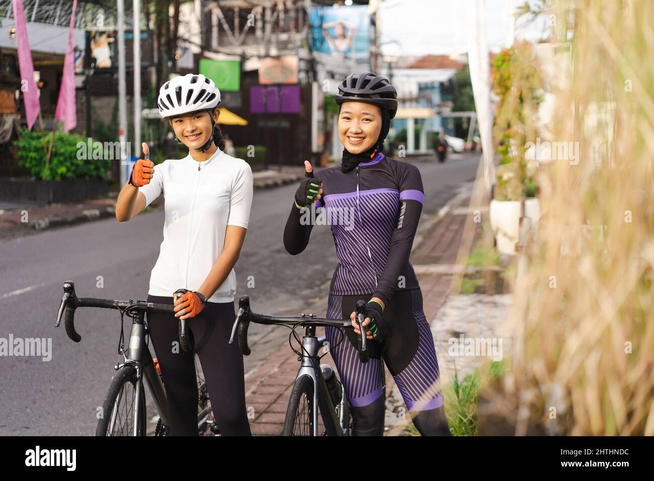 Asian teen ride bike helmet hi-res stock photography and images - Alamy