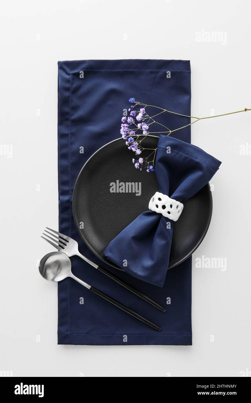 Elegant table setting with flowers on white background Stock Photo - Alamy