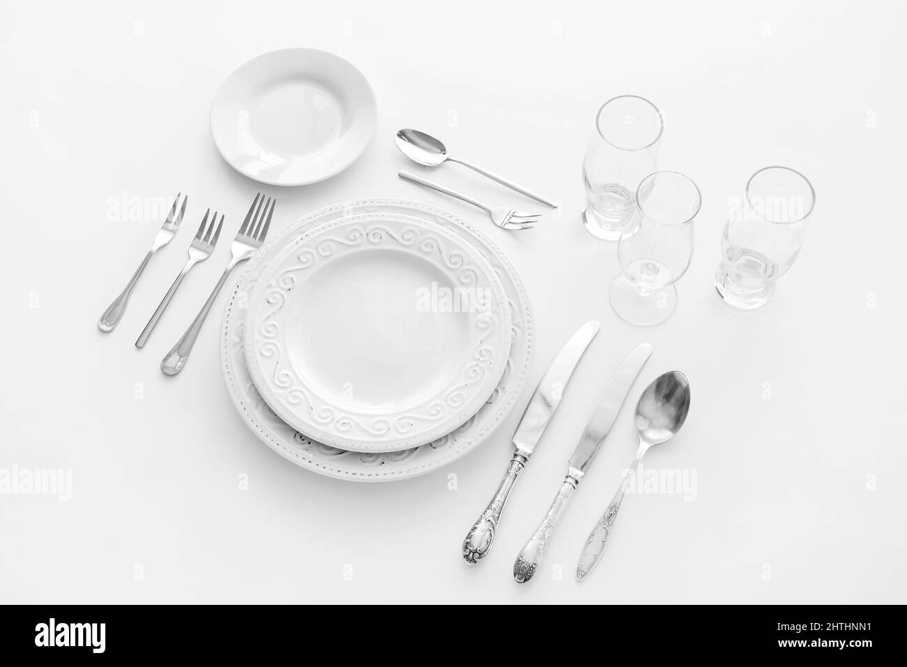 Elegant table setting on white background Stock Photo - Alamy