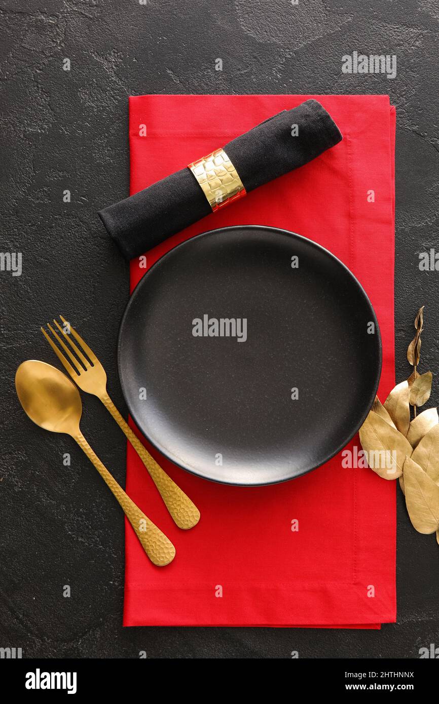 Elegant table setting on dark background Stock Photo - Alamy