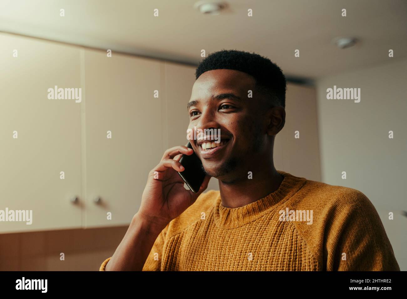african american male chatting on cellular device Stock Photo - Alamy