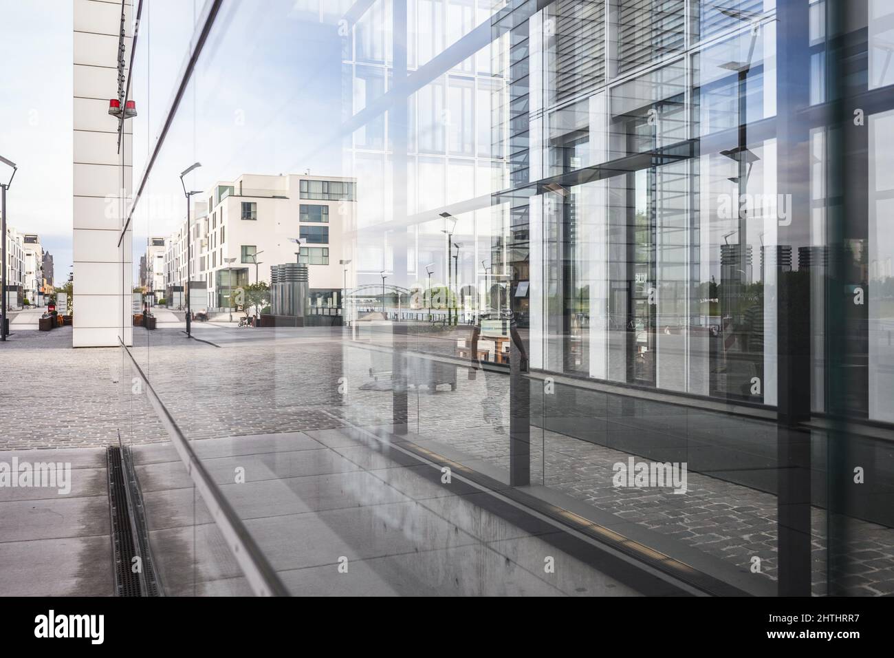 View of a modern office exterior with sunlight beaming through the ...