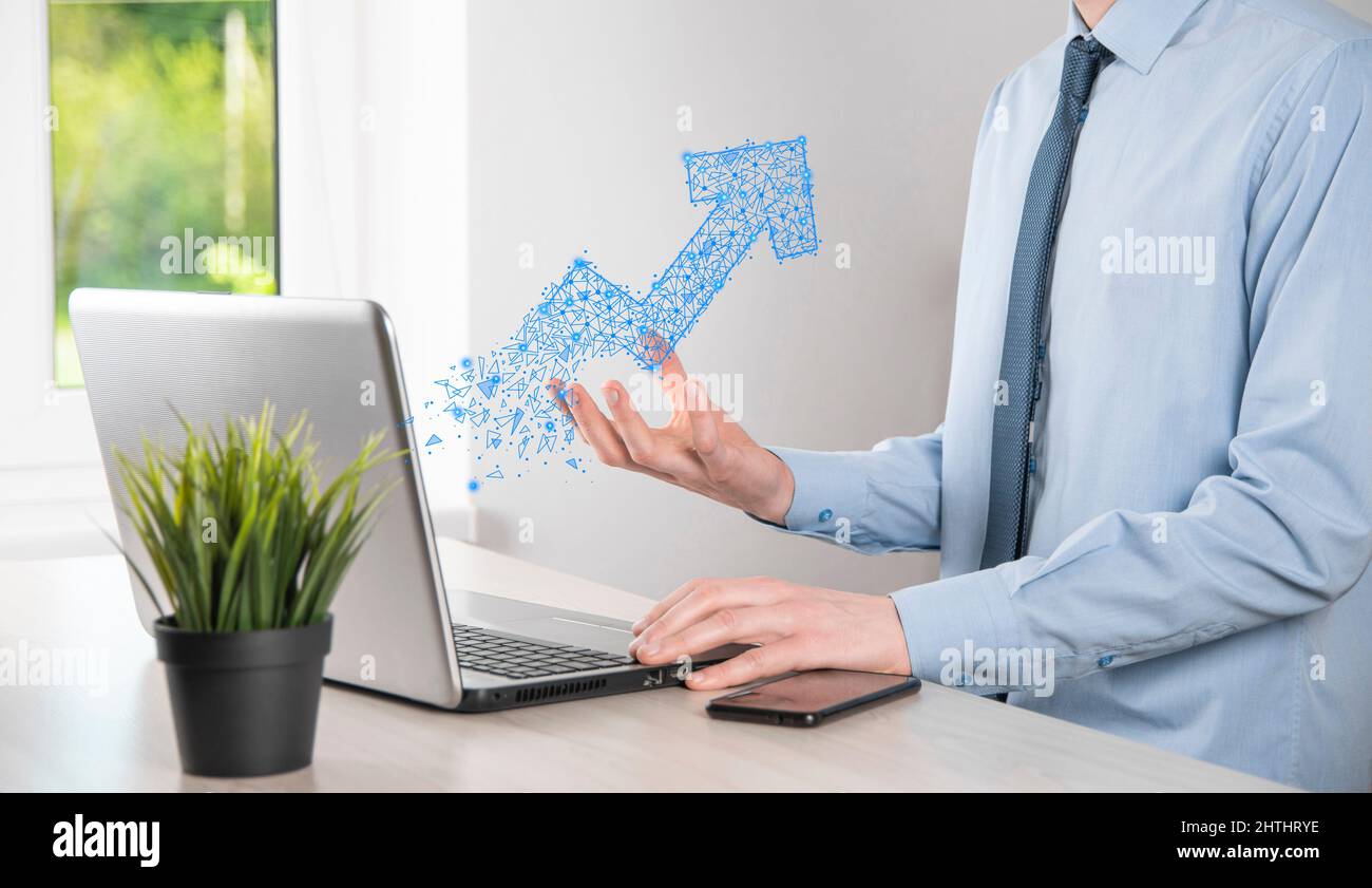 Businessman hold graph, arrow of positive growth icon.pointing at ...