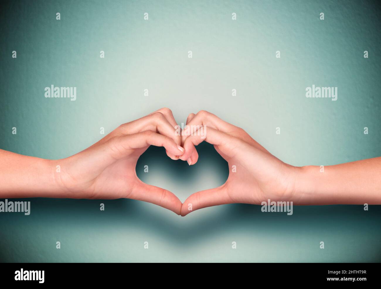 Caring hands making a heart hi-res stock photography and images - Alamy