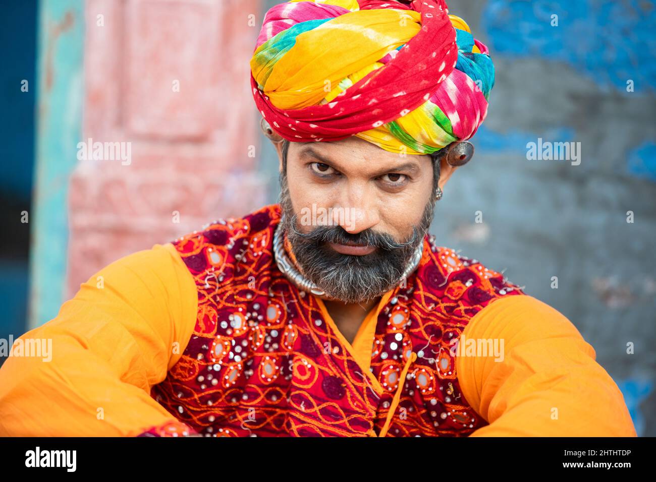 Closeup of serious traditional north indian man wearing colorful attire ...