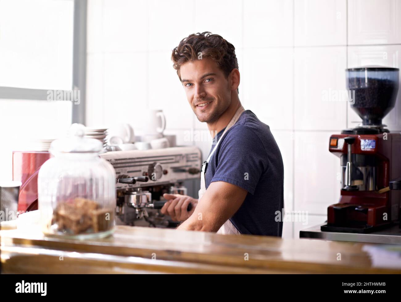 You name the blend and hell make it. Portrait of a young male barista ...