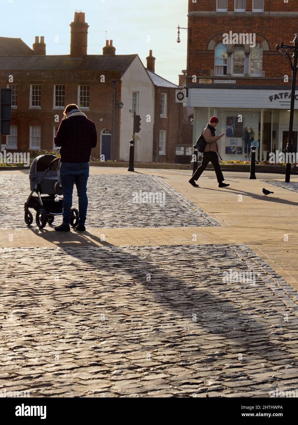 Man with pushchair - early morning in Market Place, Abingdon c3 Stock ...