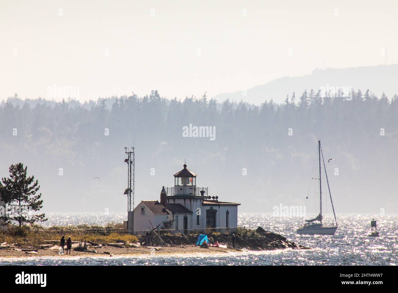 Lighthouse boat light ocean ship water hi-res stock photography and ...