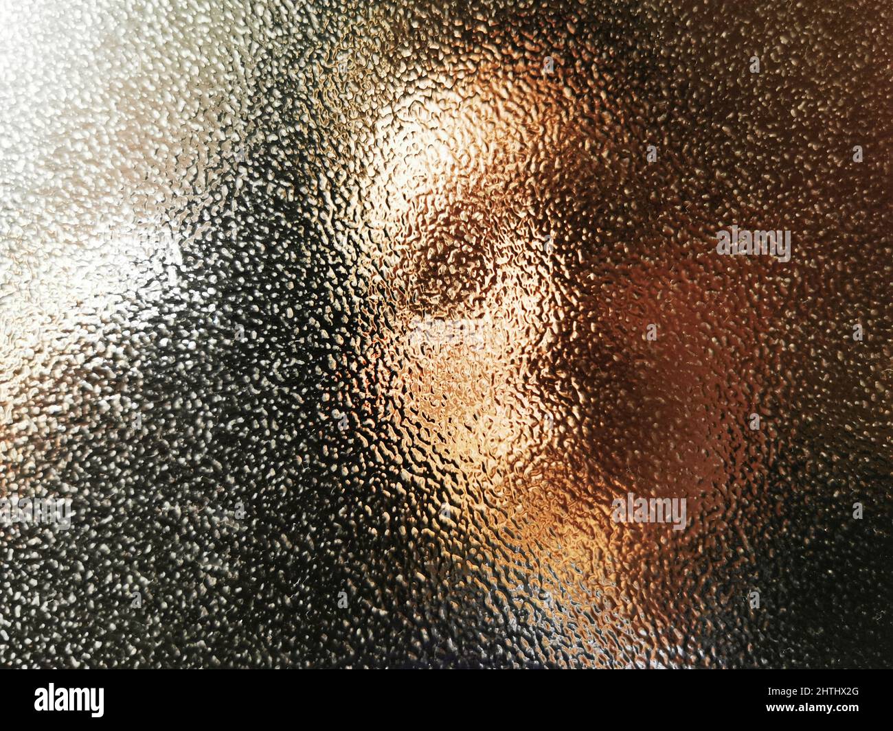 Person's face seen behind the glass texture with blurred effect Stock ...