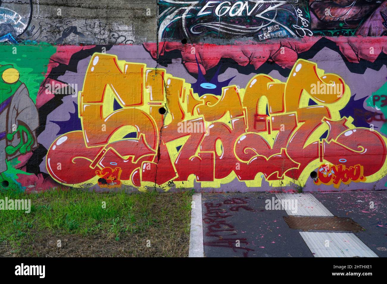 Graffiti street art on the walls of the railway in Lambrate district ...
