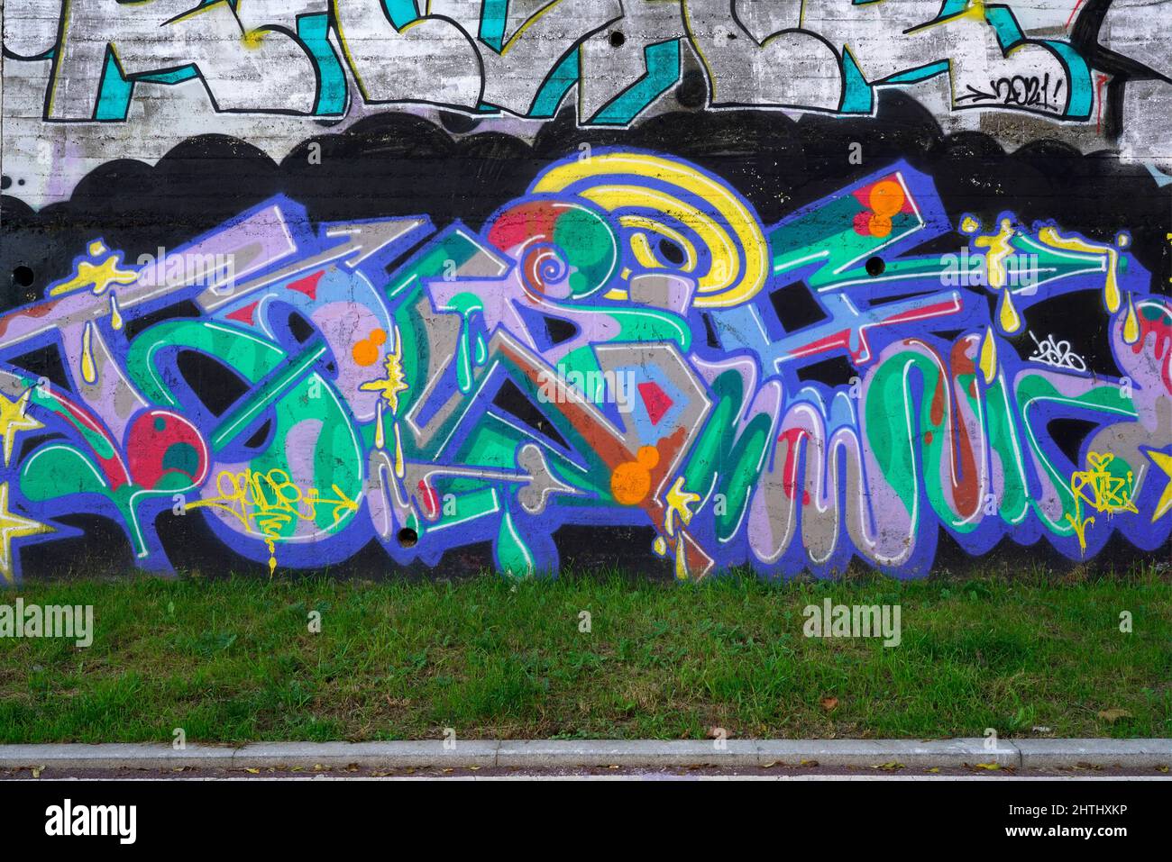 Graffiti street art on the walls of the railway in Lambrate district ...