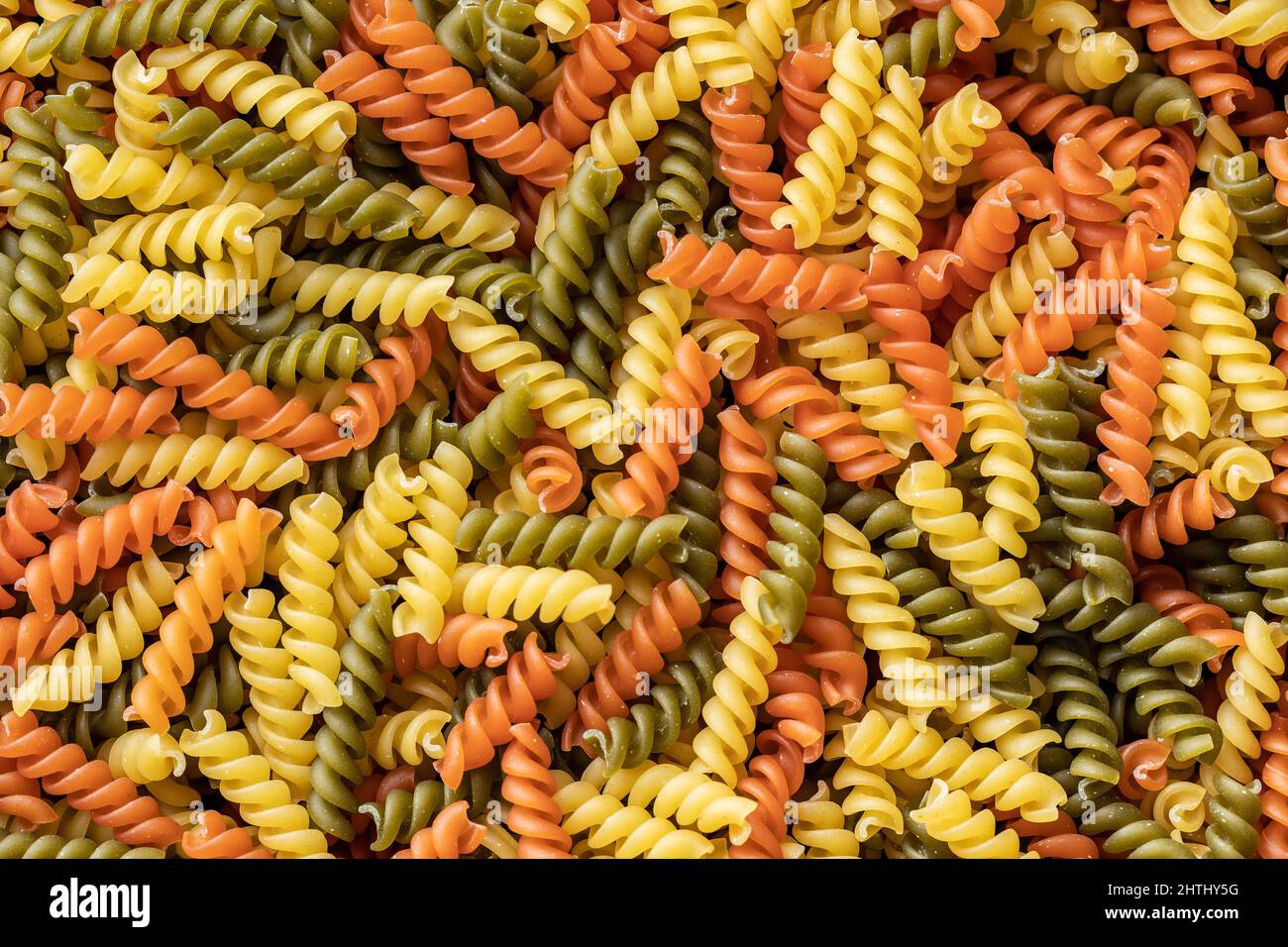 Three colors fusilli pasta. Colorful italian raw pasta. Top view Stock ...