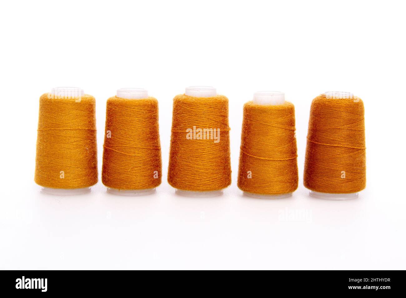 Orange spool of thread isolated on white background. Skein of woolen ...