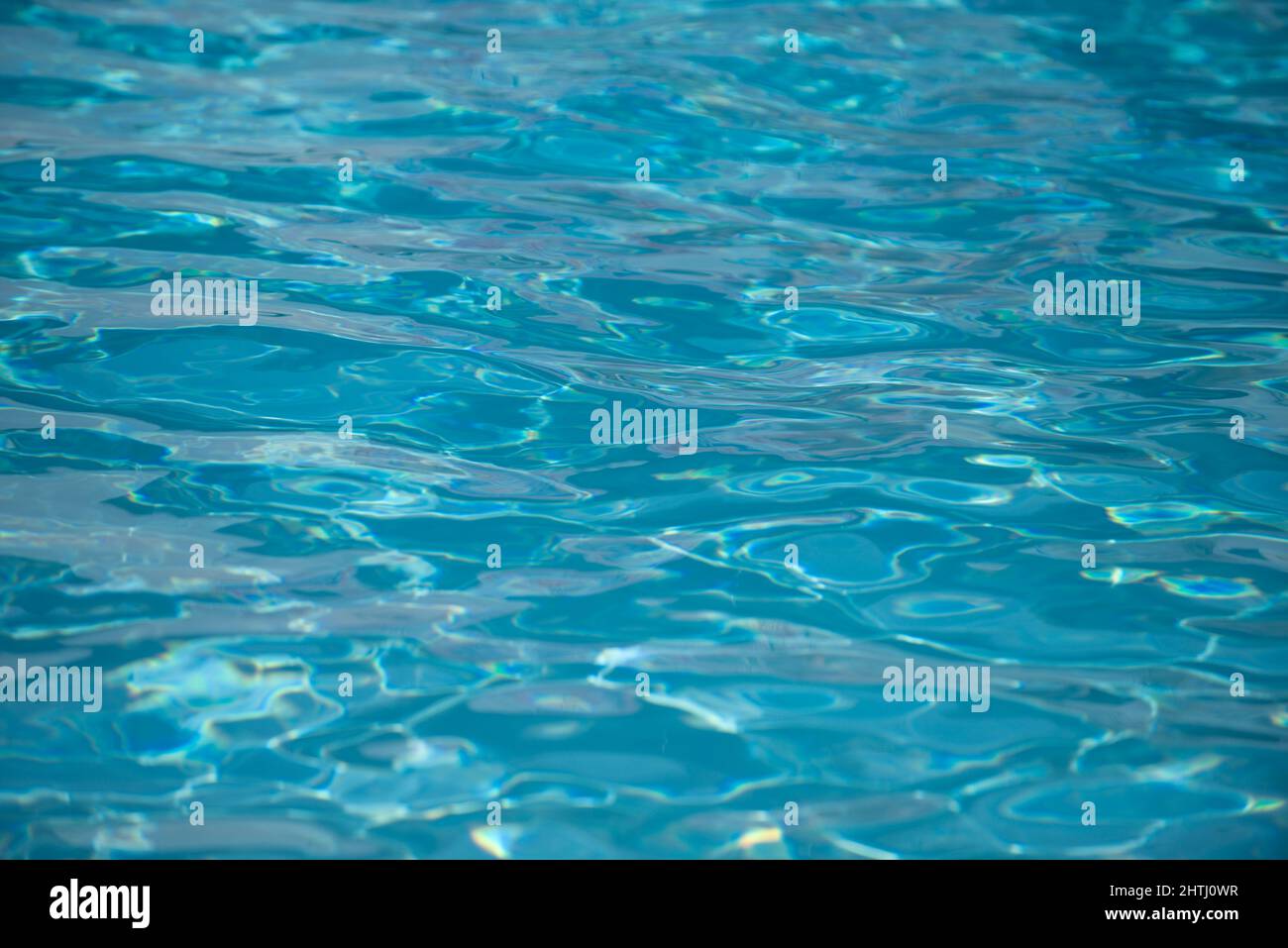Abstract ripple wave and clear turquoise water surface in swimming pool ...