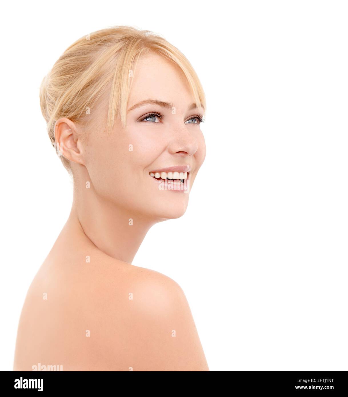 Beauty glancing over her shoulder. Studio shot of a beautiful young ...