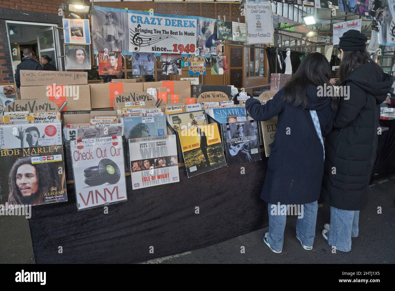 Visitors to vynil records stall at street market, restaurants and cafes ...