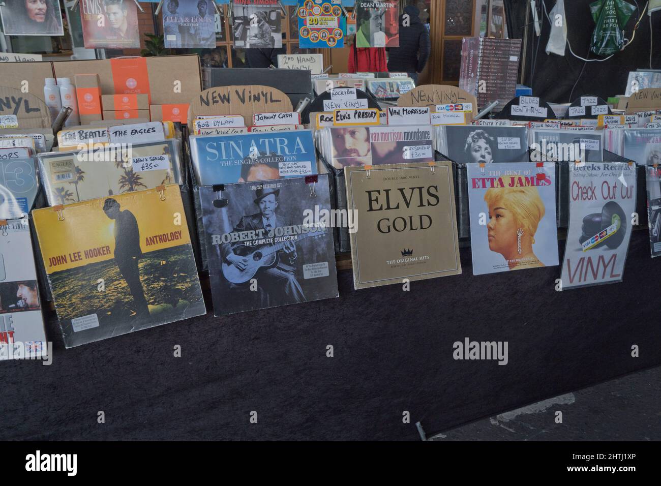 Visitors to vynil records stall at street market, restaurants and cafes ...