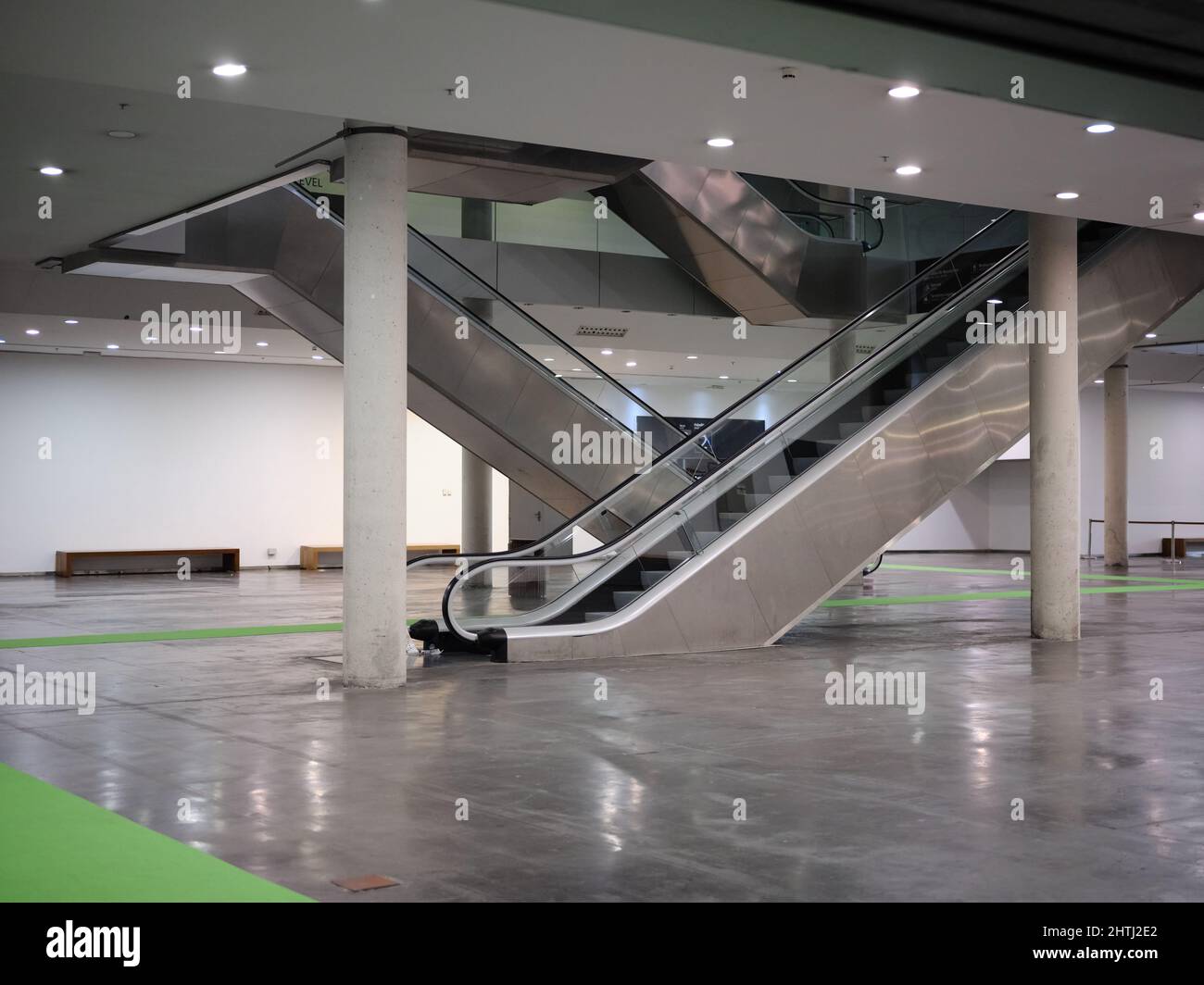 Escalators in the underground floor of a car park Stock Photo - Alamy