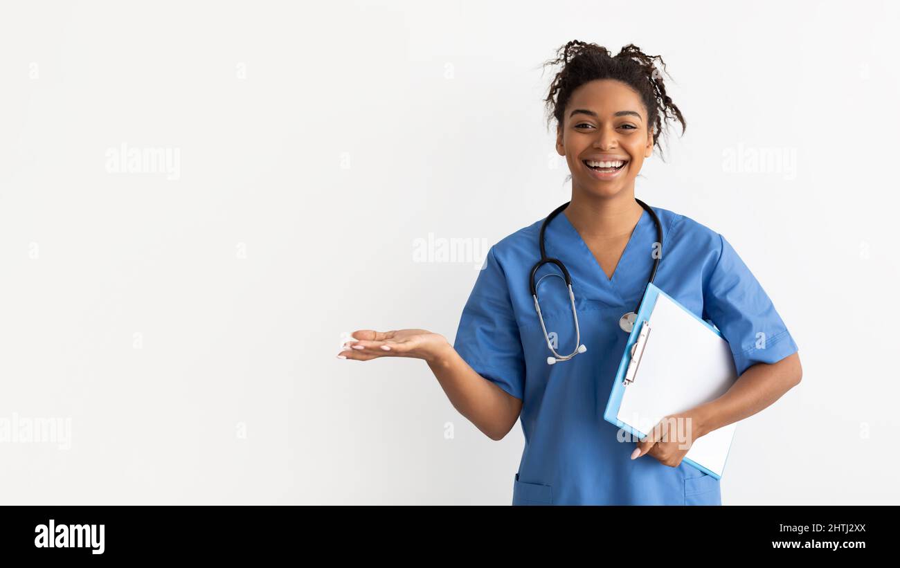 Portrait of black doctor smiling and posing to camera Stock Photo - Alamy