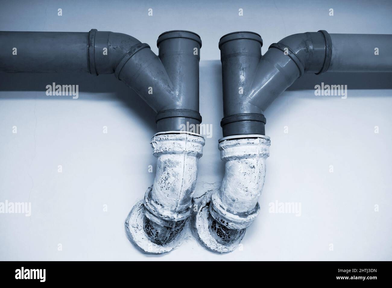 Pipes for the water drain on a background of a wall Stock Photo - Alamy