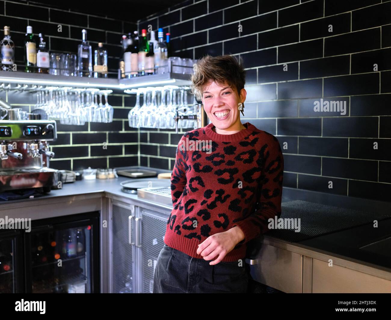 Portrait of a manager of a restaurant with a modern look inside the ...