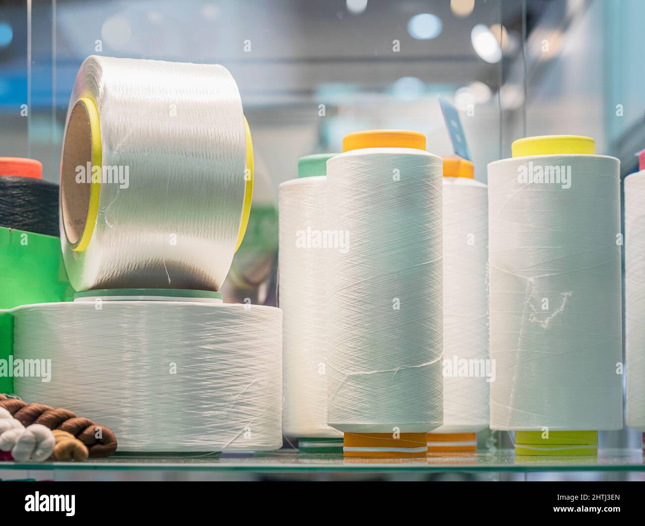 Large spools of thread close-up. Bobbins of thread for sewing ...