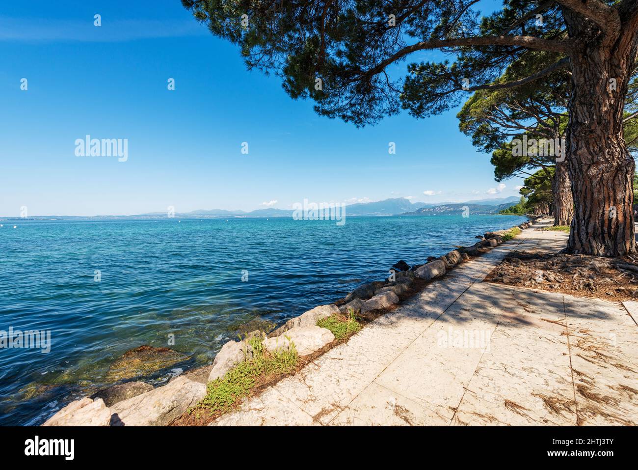 Promenade on lakeshore of Lake Garda, Lazise village with the bicycle ...