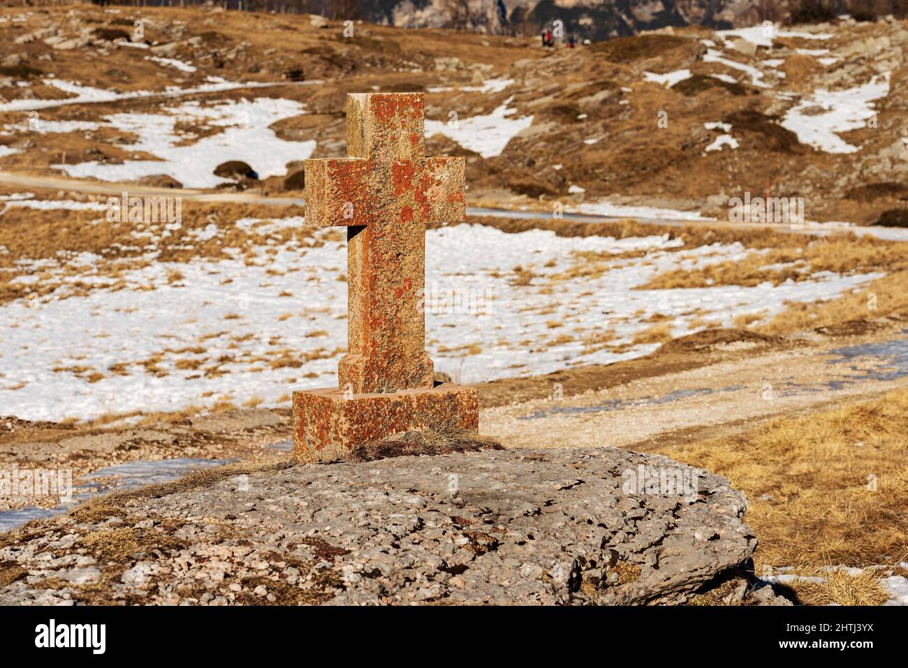 Old religious cross in red and orange stone, in a rural scene, Regional ...